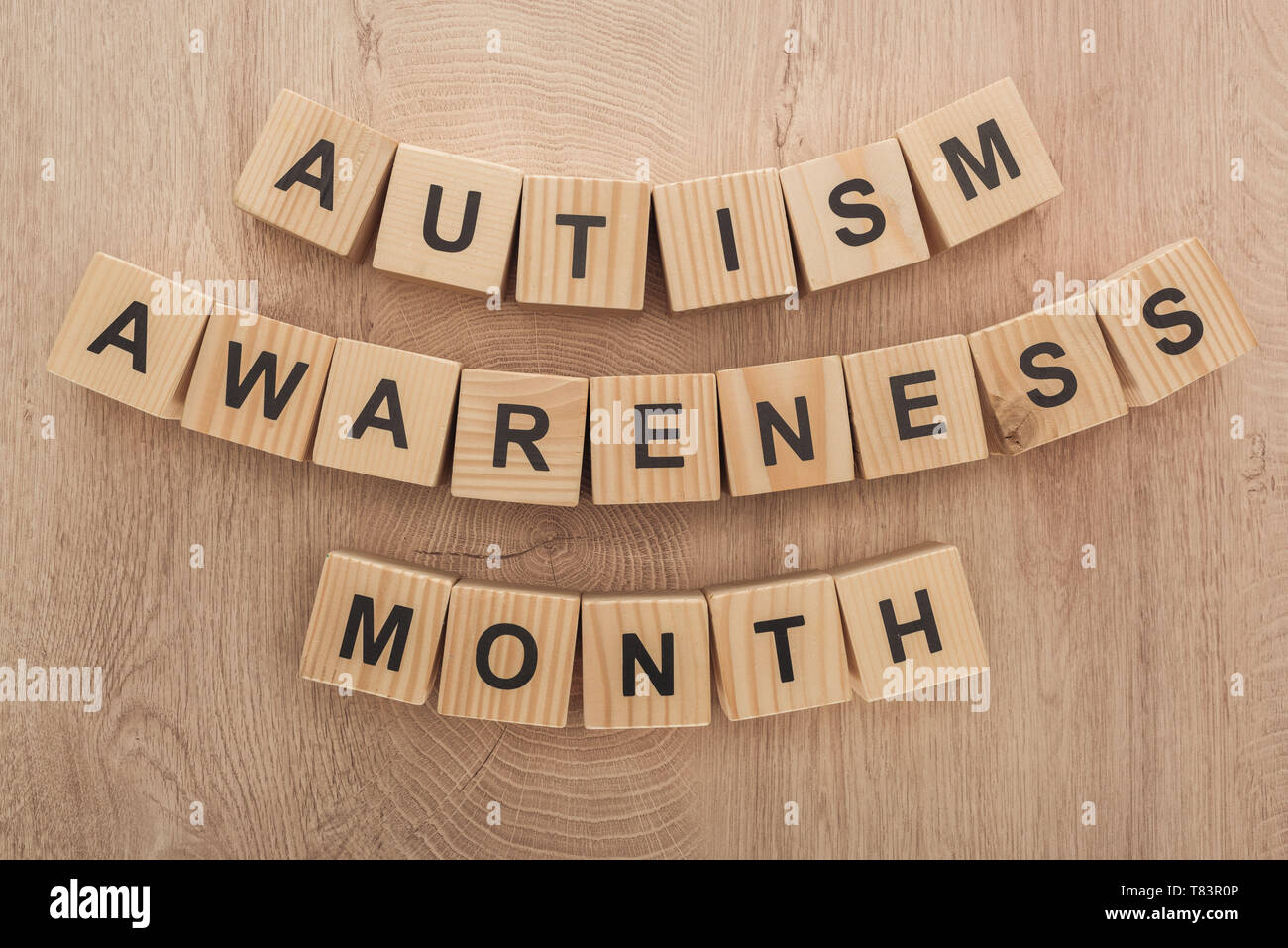 top view of autism awareness month words made of wooden cubes Stock ...