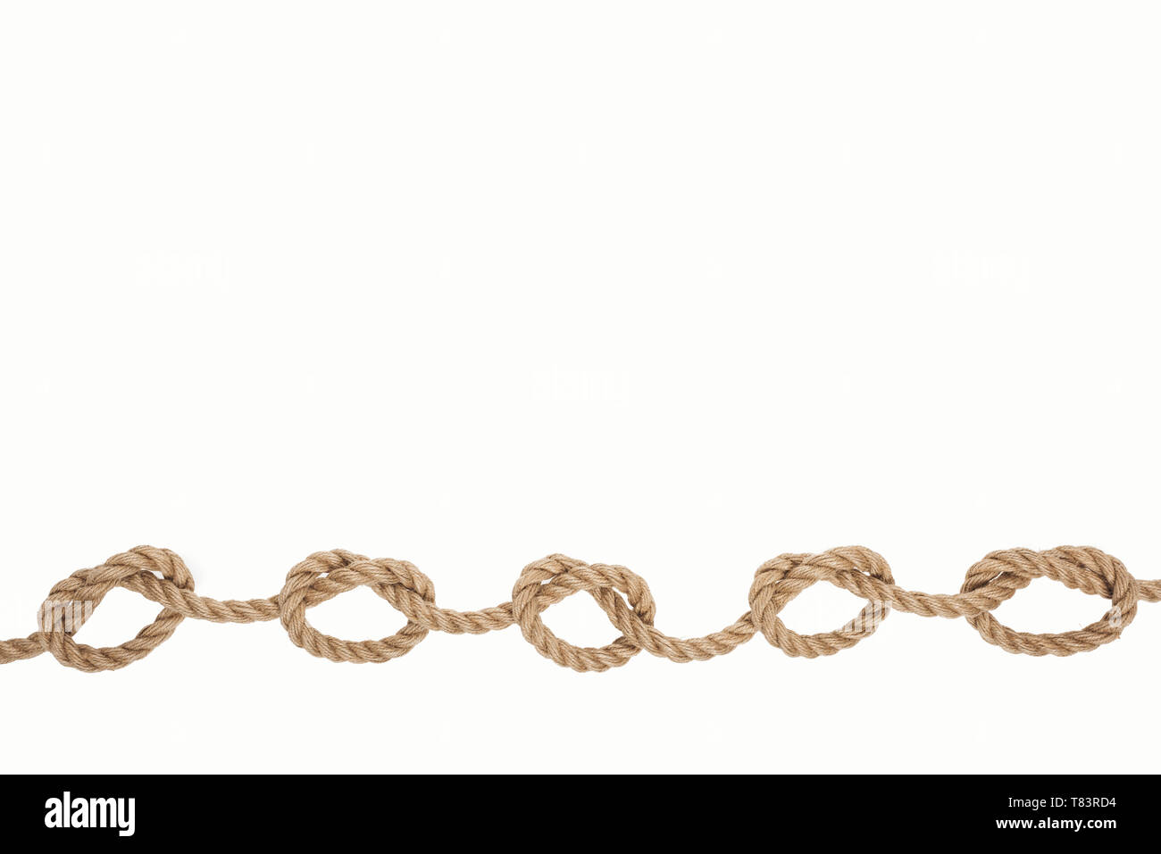 nautical brown rope with sea knots isolated on white Stock Photo - Alamy