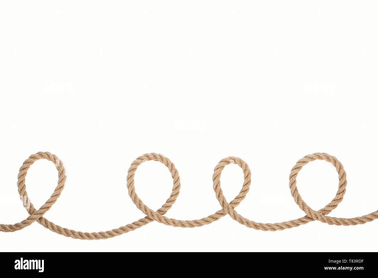 long and curled brown rope isolated on white Stock Photo - Alamy