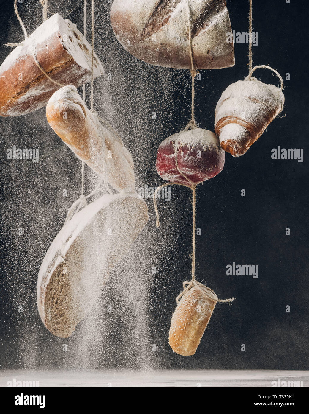flour falling at homemade bread hanging on ropes Stock Photo - Alamy