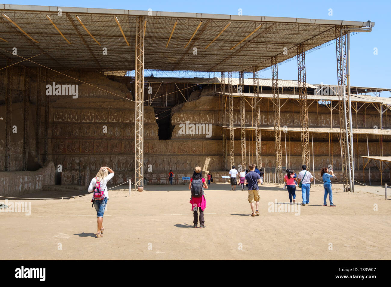 Visitors on a guided tour to the Huaca of the Moon at The Ancient City ...