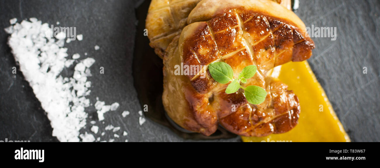 Fried Goose Liver .Foie Gras with Mango Puree Stock Photo - Alamy