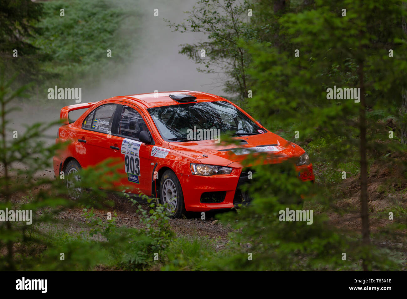 Fast rally car on a dusty dirt road in sweden Stock Photo - Alamy