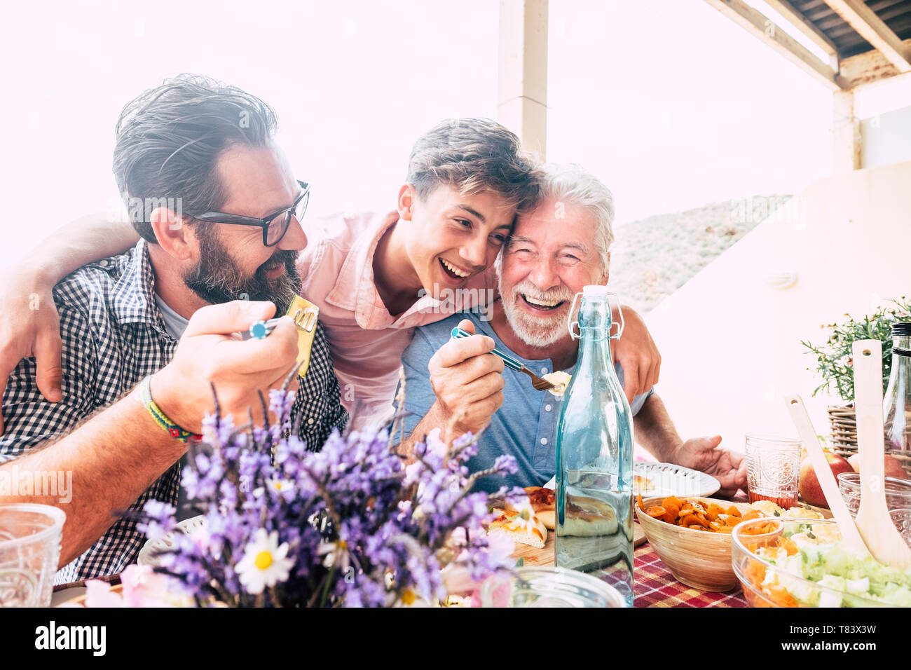 Happy people family concept laugh and have fun together with three ...