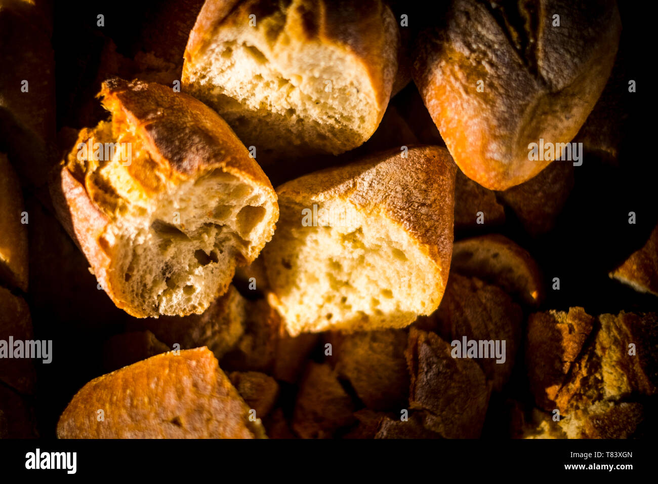 Vertical view of bread in dark background Stock Photo - Alamy