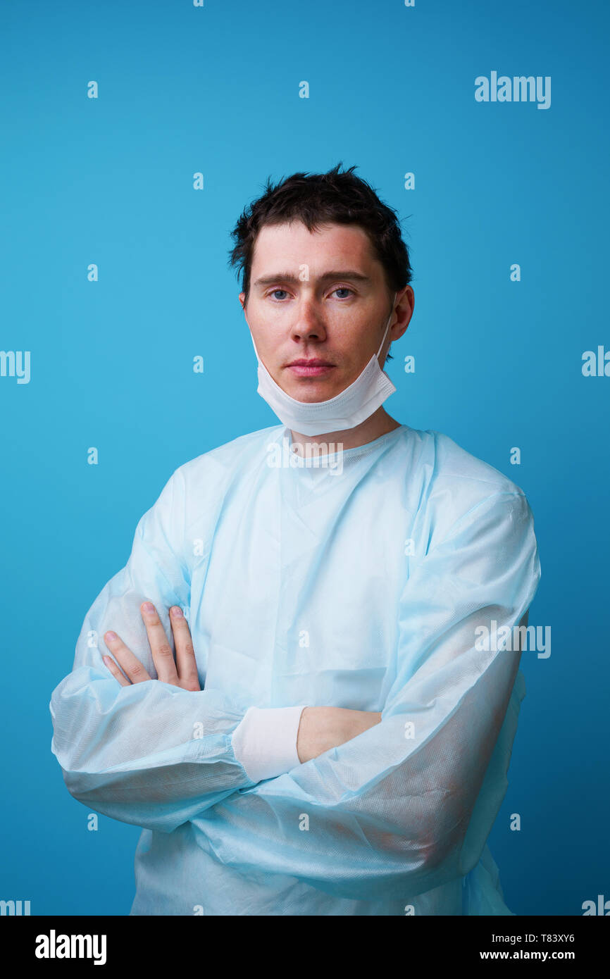Surgeon in sterile blue uniform Stock Photo - Alamy