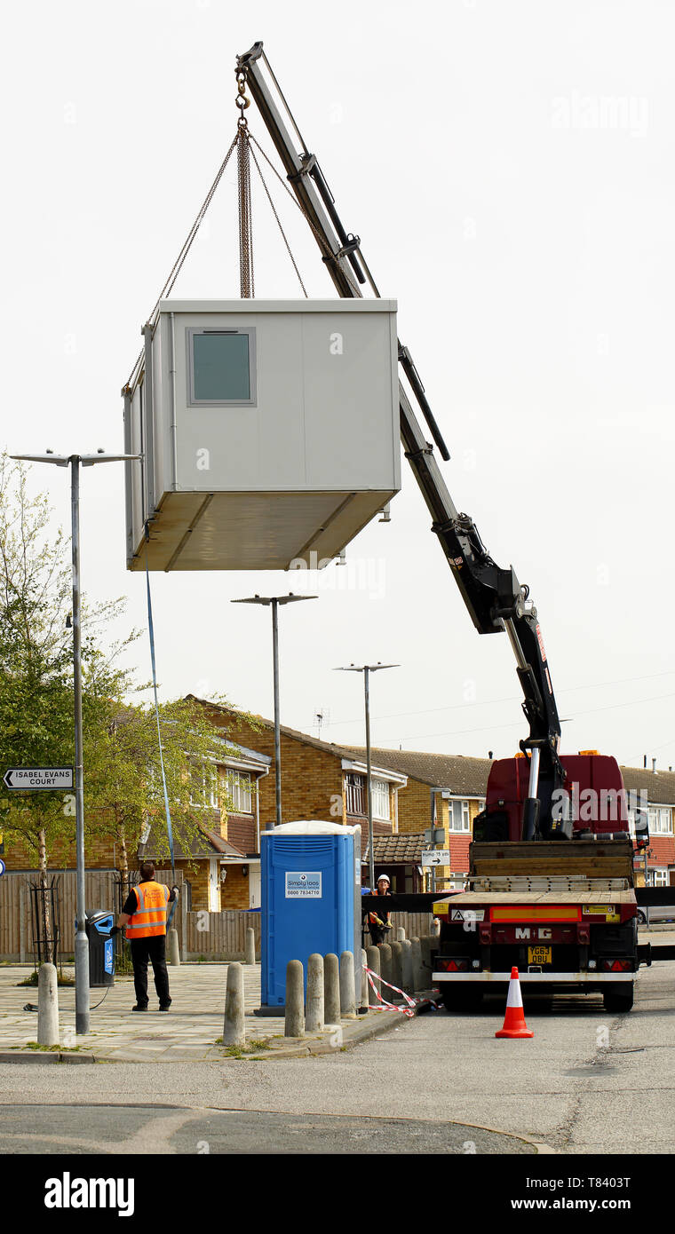 A temporary Polling Booth being carefully maneuvered into position ...
