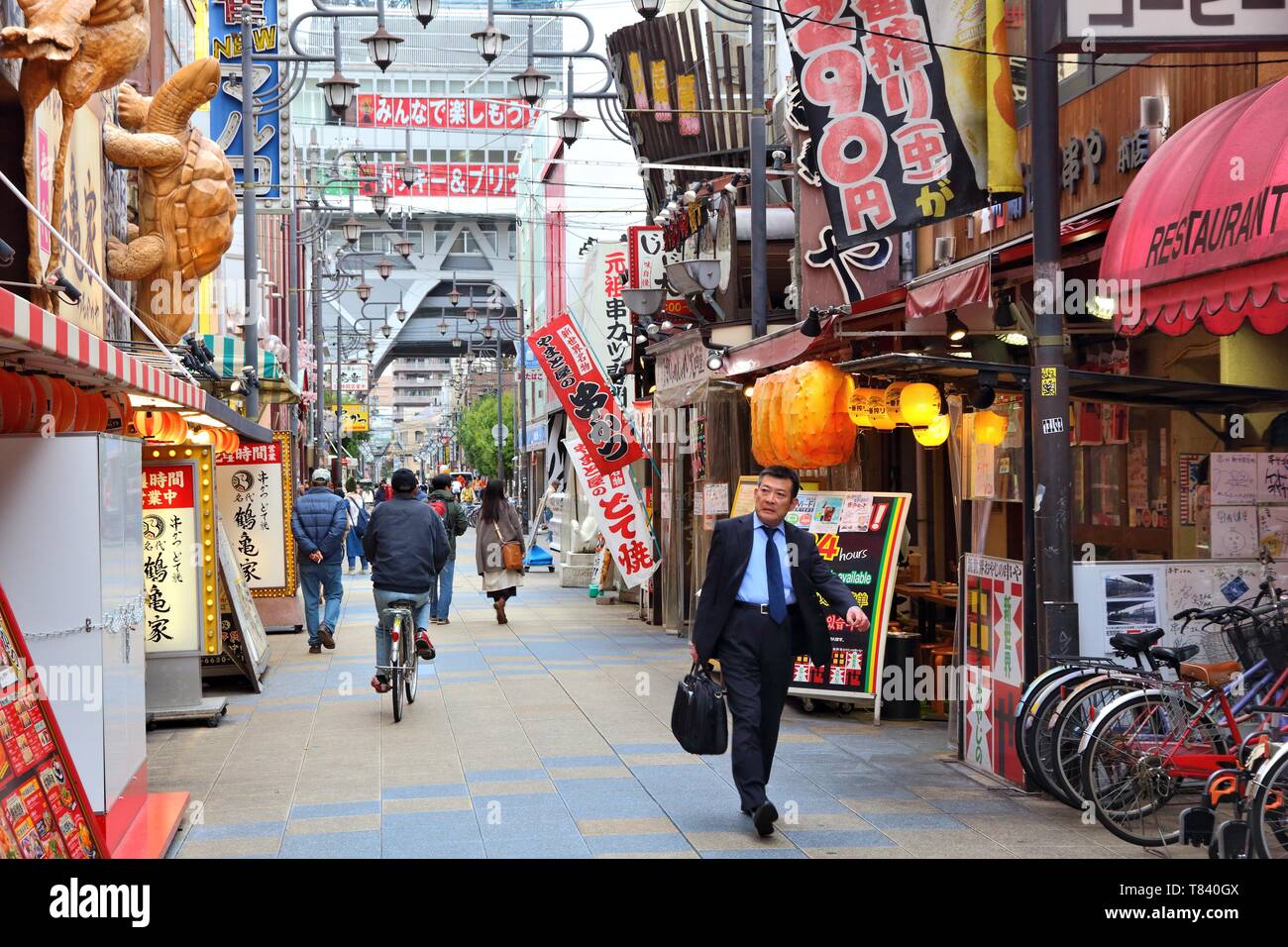 OSAKA, JAPAN - NOVEMBER 23, 2016: People walk in Shinsekai neighborhood ...