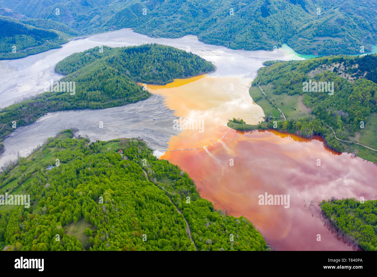 Aerial view of a big waste decanting lake, tailing pond. Mining water ...