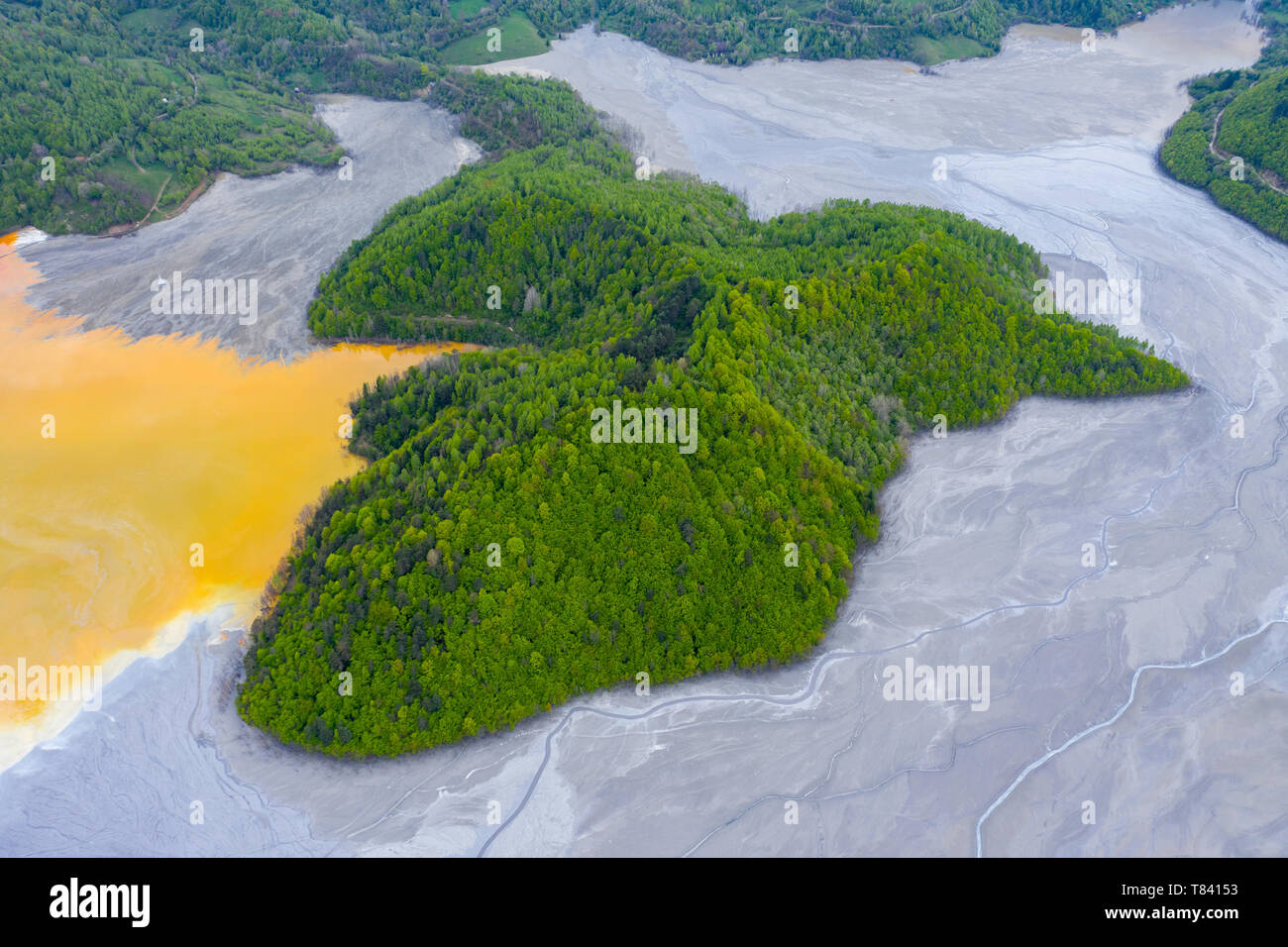 Aerial view of a big waste decanting lake, tailing pond. Mining water ...