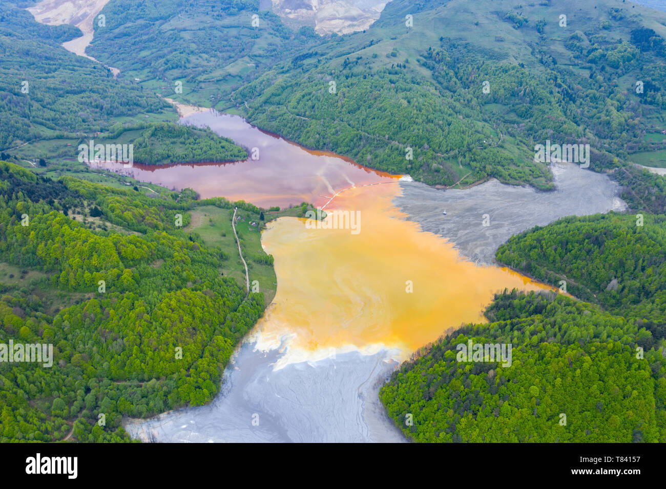 Aerial view of a big waste decanting lake, tailing pond. Mining water ...