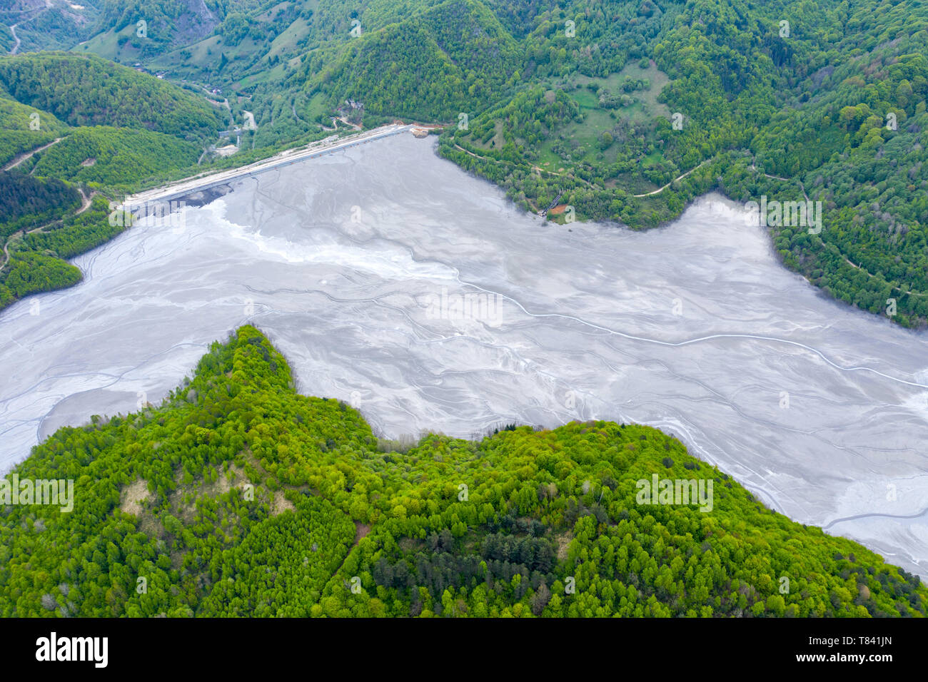 Aerial view of a big waste decanting lake, tailing pond. Mining water ...