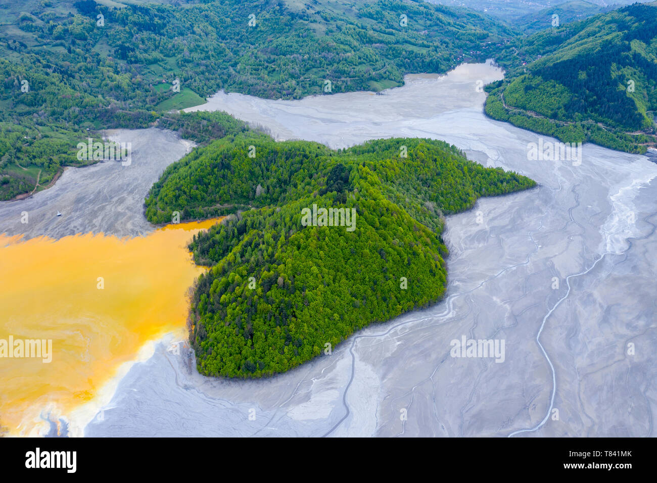 Aerial view of a big waste decanting lake, tailing pond. Mining water ...