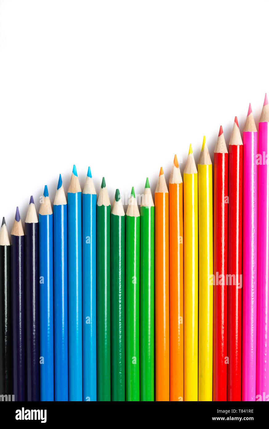 colourful still life with pencils and art supplies on white background ...