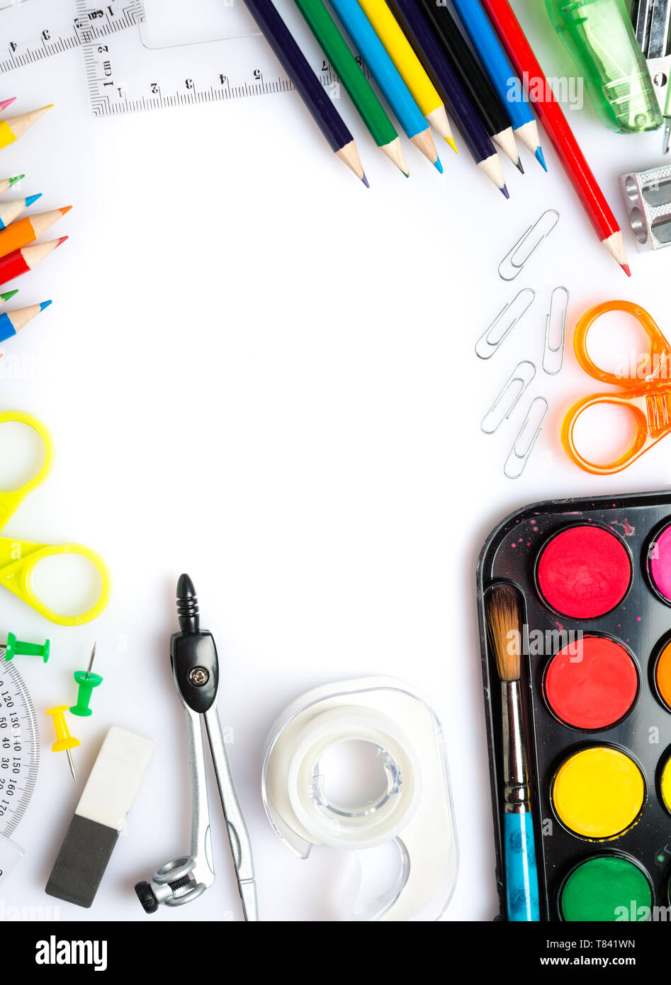 colourful still life with pencils and art supplies on white background ...