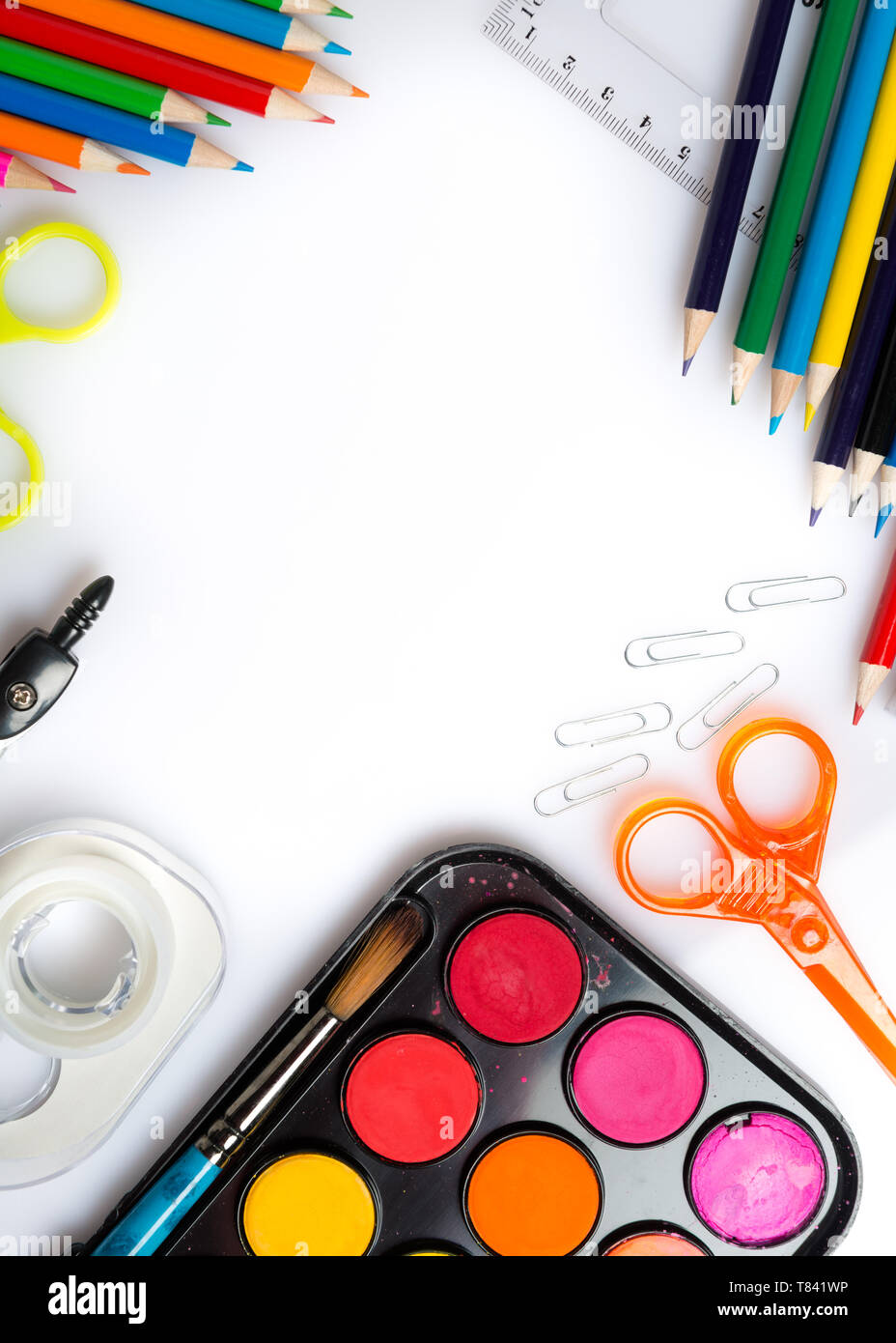 colourful still life with pencils and art supplies on white background ...