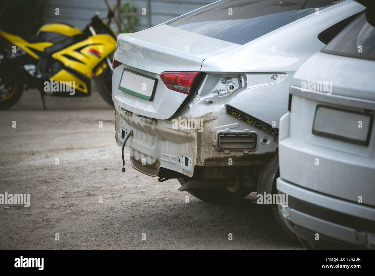 Broken and crashed modern cars after an accident on street, damaged ...