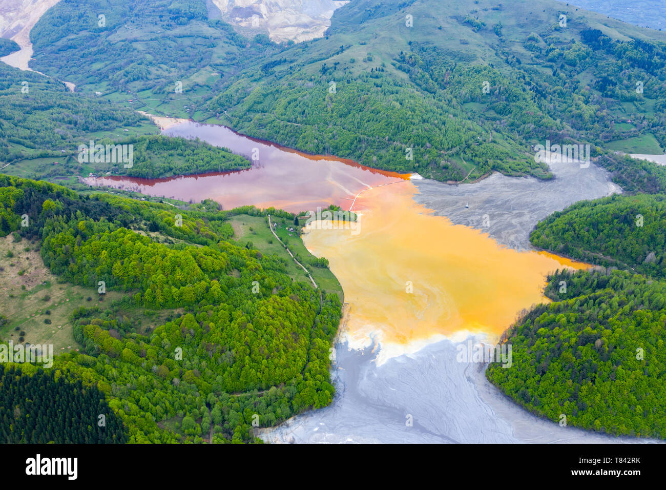 Aerial view of a big waste decanting lake, tailing pond. Mining water ...