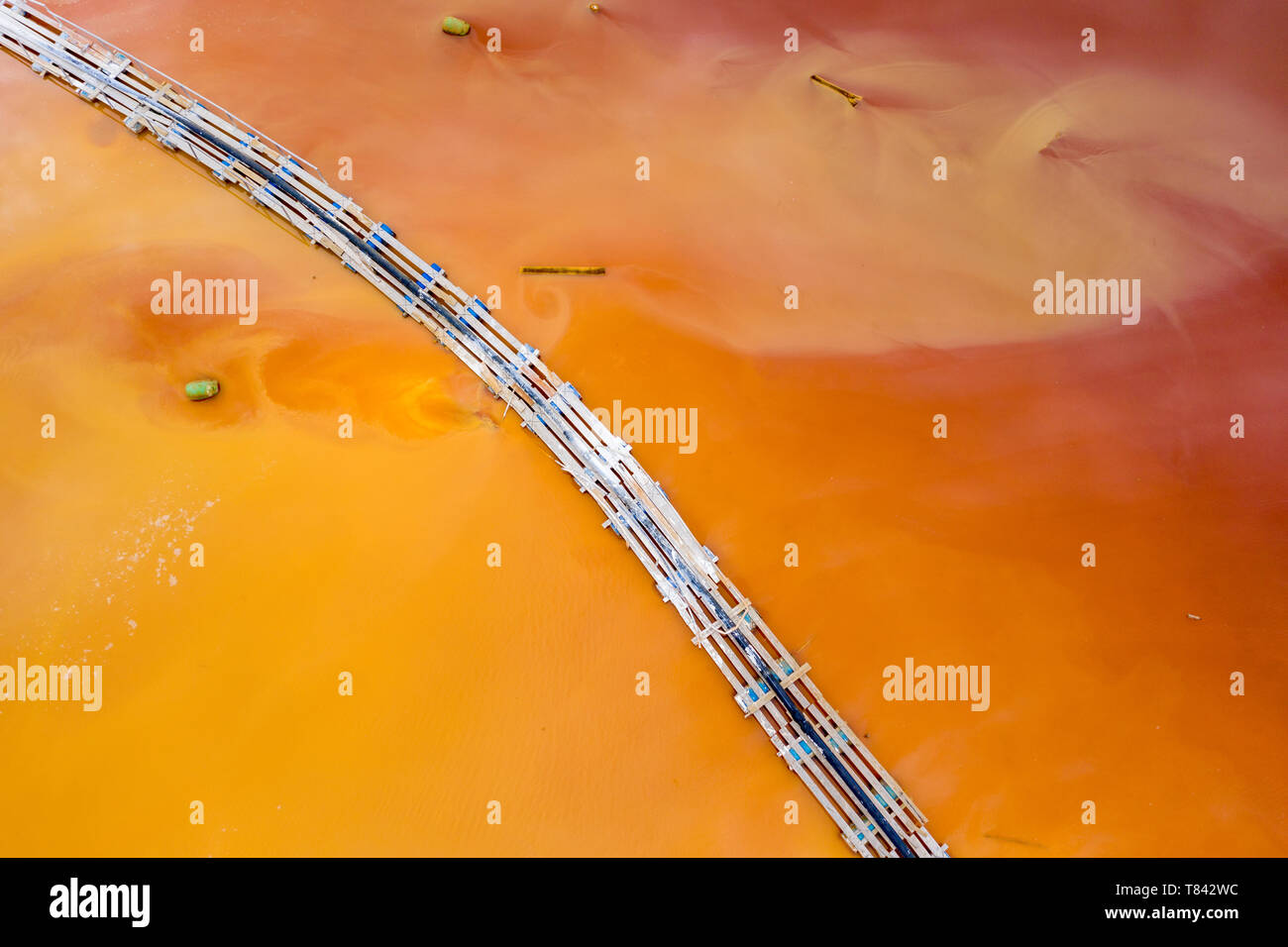 Aerial view of mining settling basin and lime supply. Colorful red ...