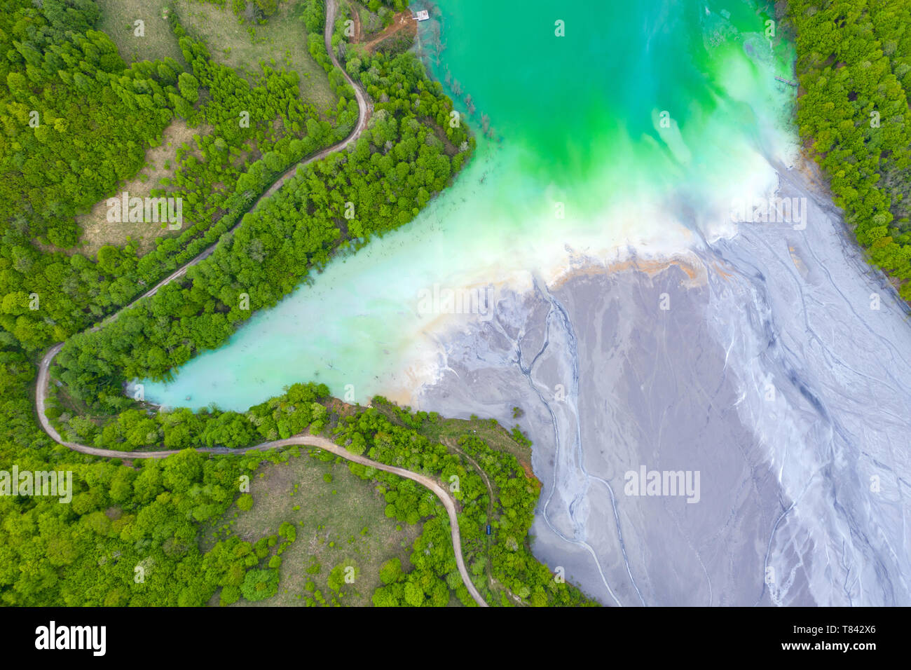 Aerial view of a big waste decanting lake, tailing pond. Mining water ...