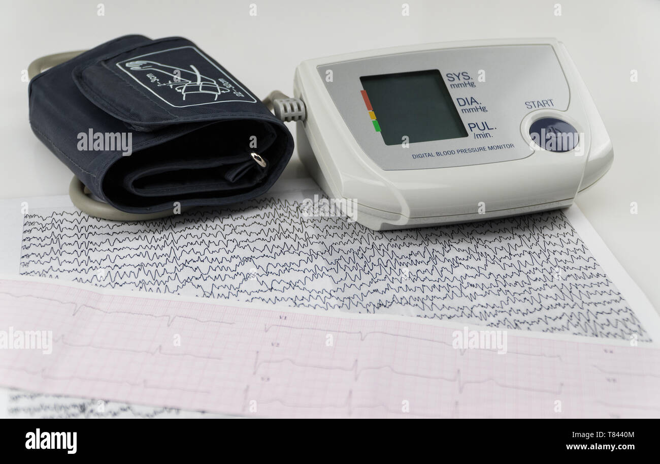 electric blood pressure monitor with ecg chart. modern household ...