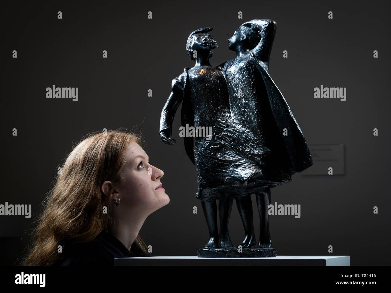 Gallery employee Megan Hampton views Girl in the Wind, 1956-57, by ...