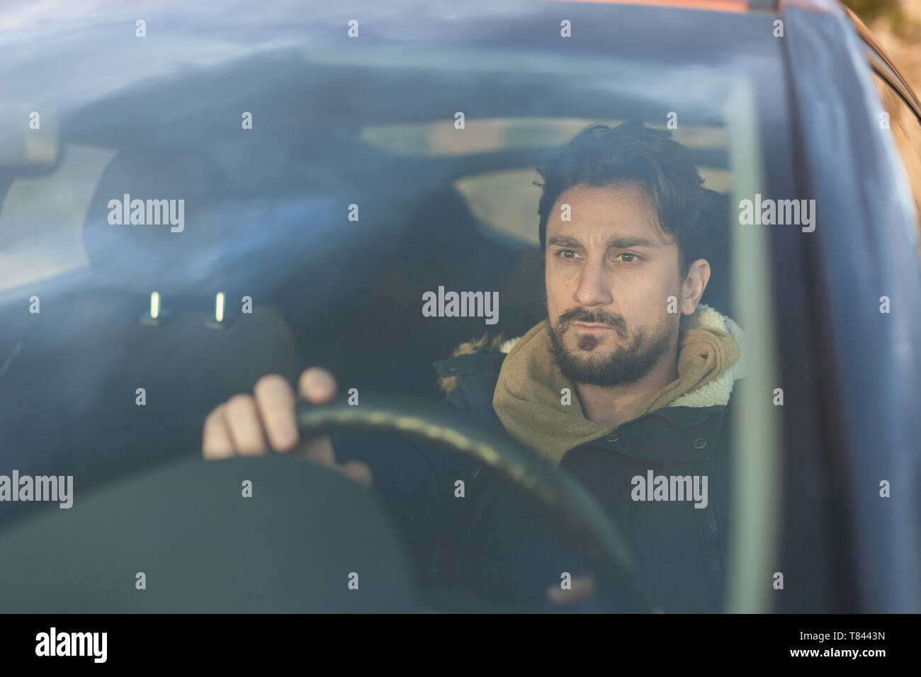 Man behind wheel Stock Photo - Alamy