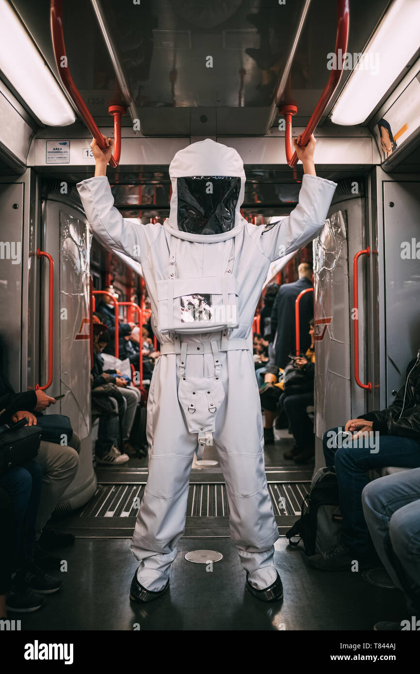 Astronaut travelling in train Stock Photo - Alamy