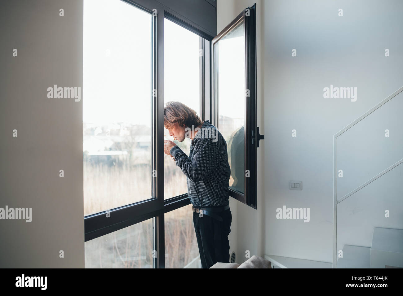 Older man looking out window hi-res stock photography and images - Alamy