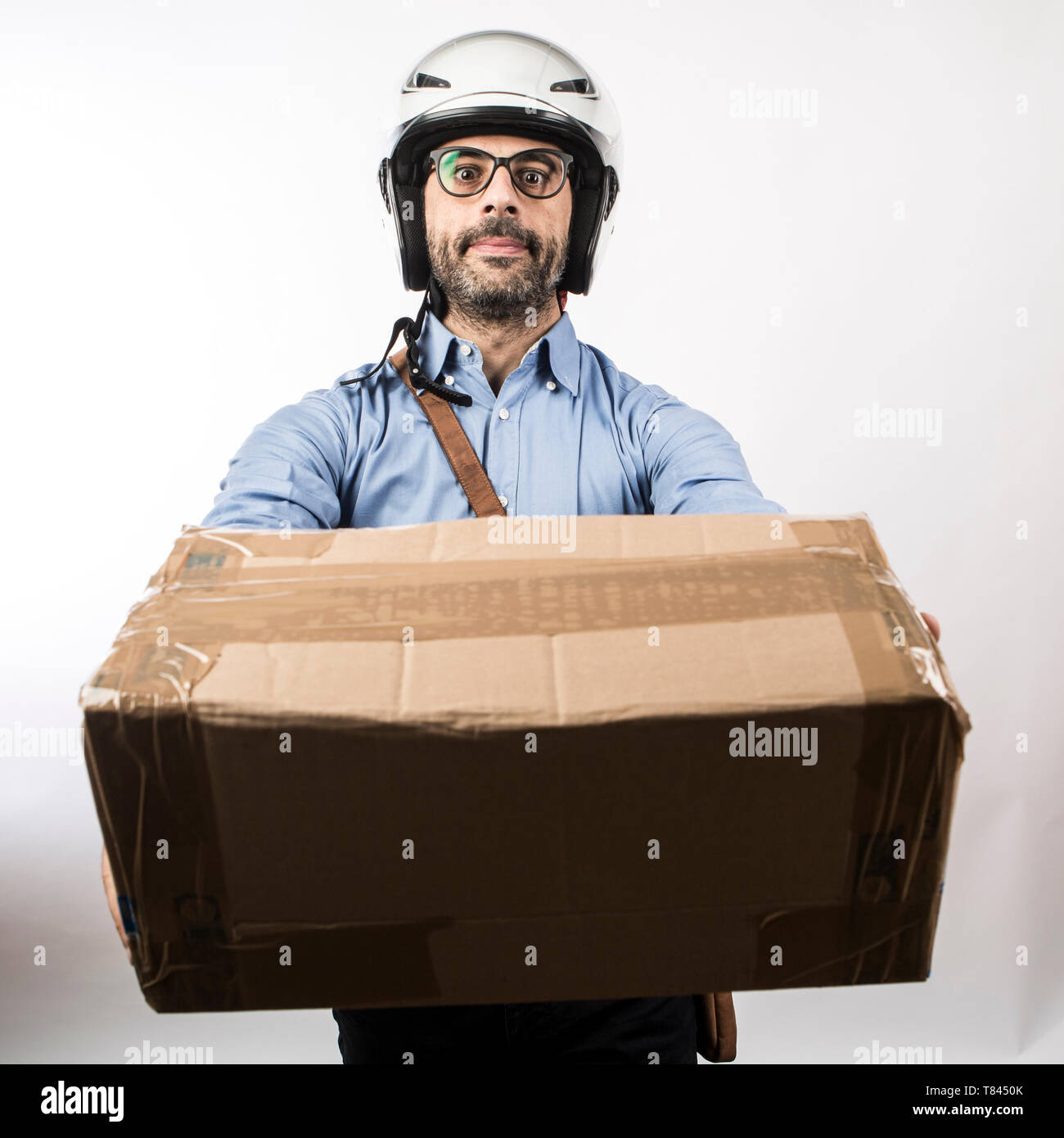 deliveryman with helmet carries a parcel, isolated on white background ...