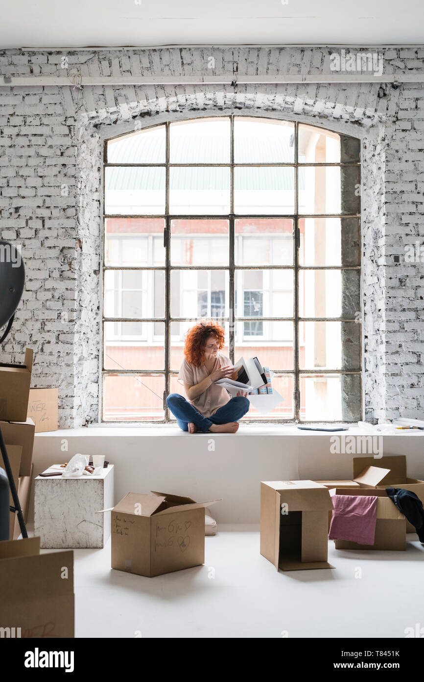 Woman Sitting On Ledge Window High Resolution Stock Photography and ...
