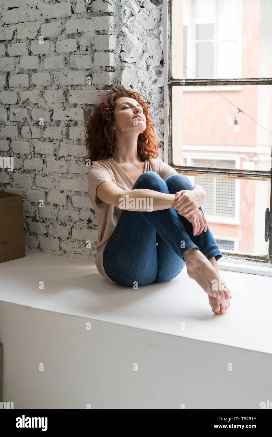 Woman Sitting On Ledge Window High Resolution Stock Photography and ...