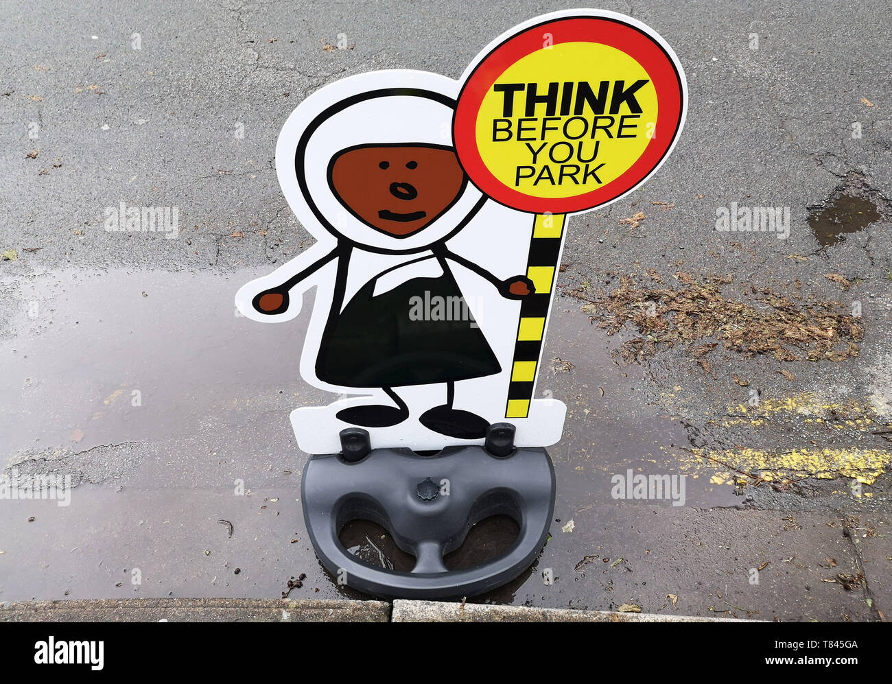 Traffic safety bollards that are drawings of small children are seen ...