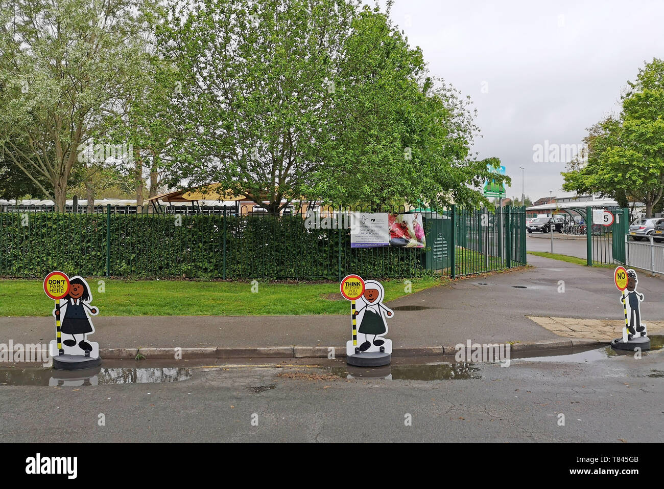Traffic safety bollards that are drawings of small children are seen ...