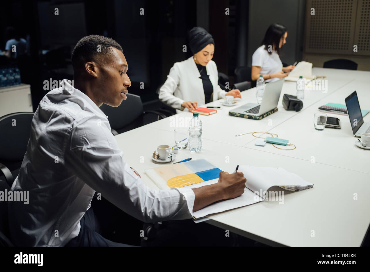 Business team preparing notes for conference table meeting Stock Photo ...