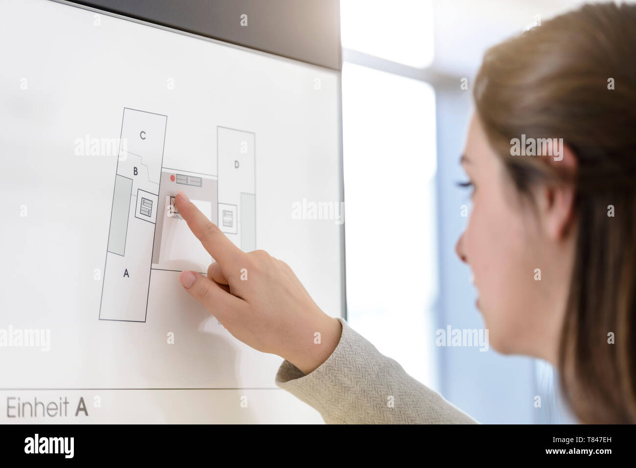 Businesswoman pointing board hi-res stock photography and images - Alamy