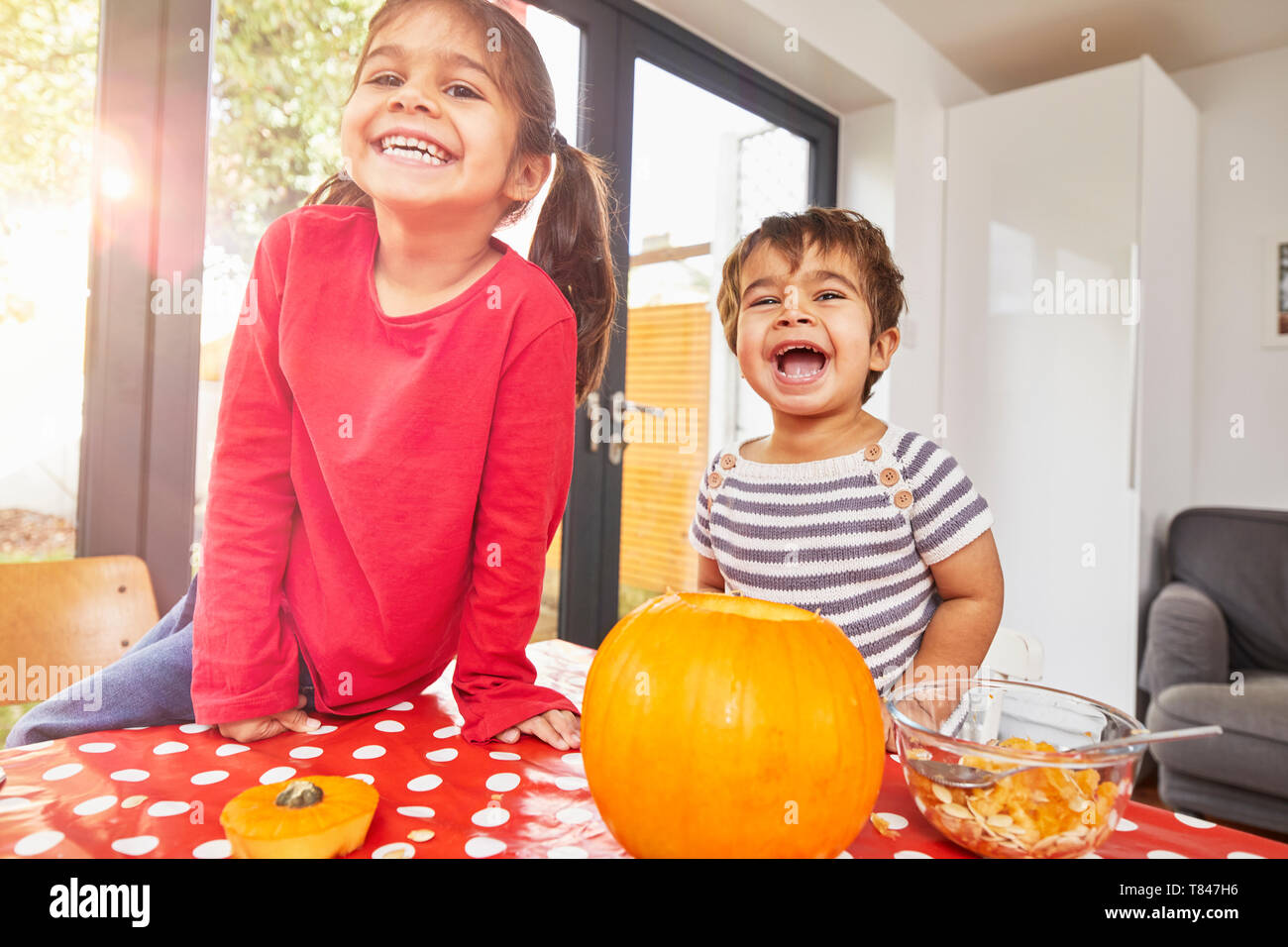 Children carving pumpkin in kitchen Stock Photo - Alamy
