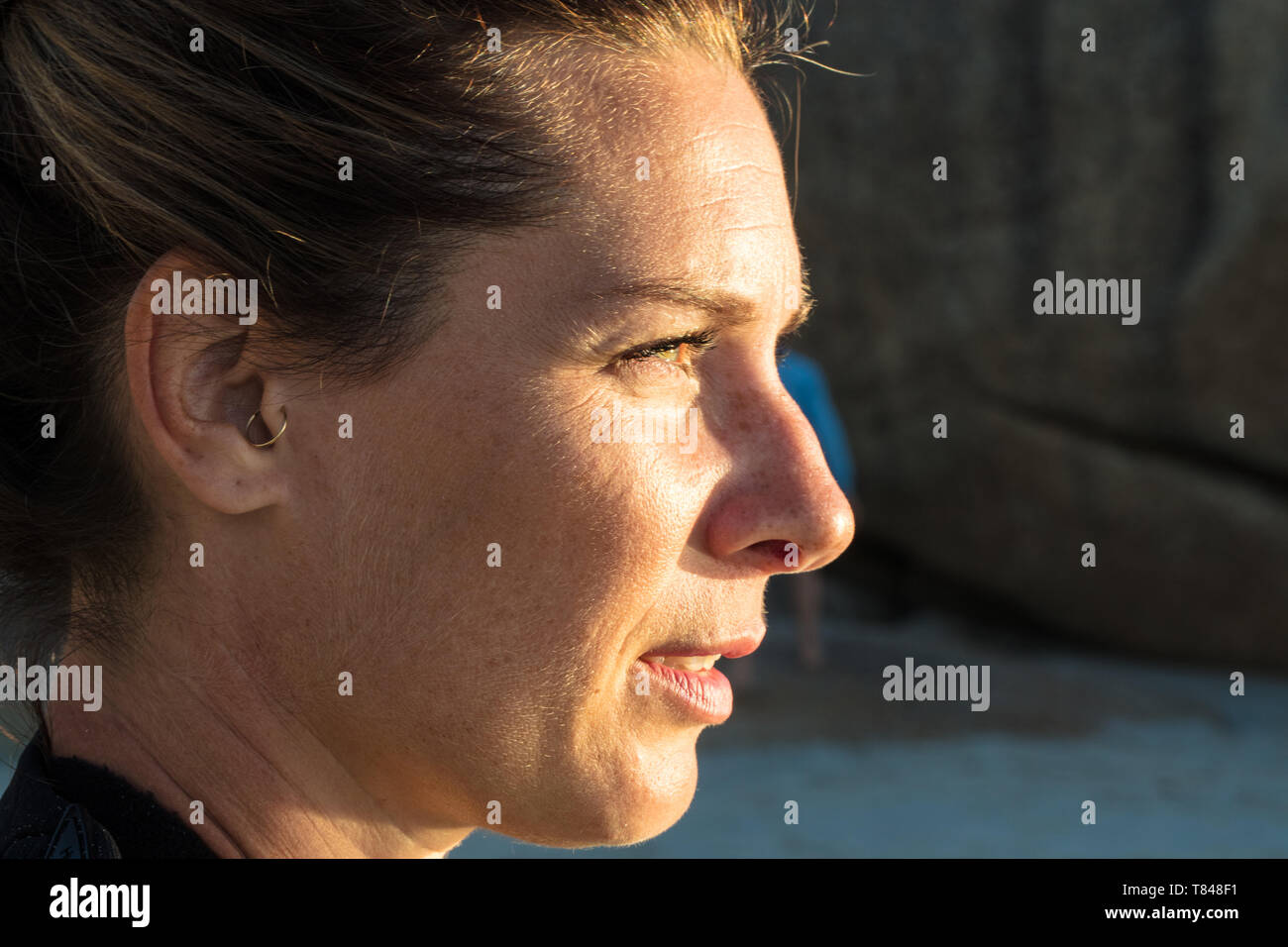 Female surfer at beach, sideview headshot, Cape Town, Western Cape ...