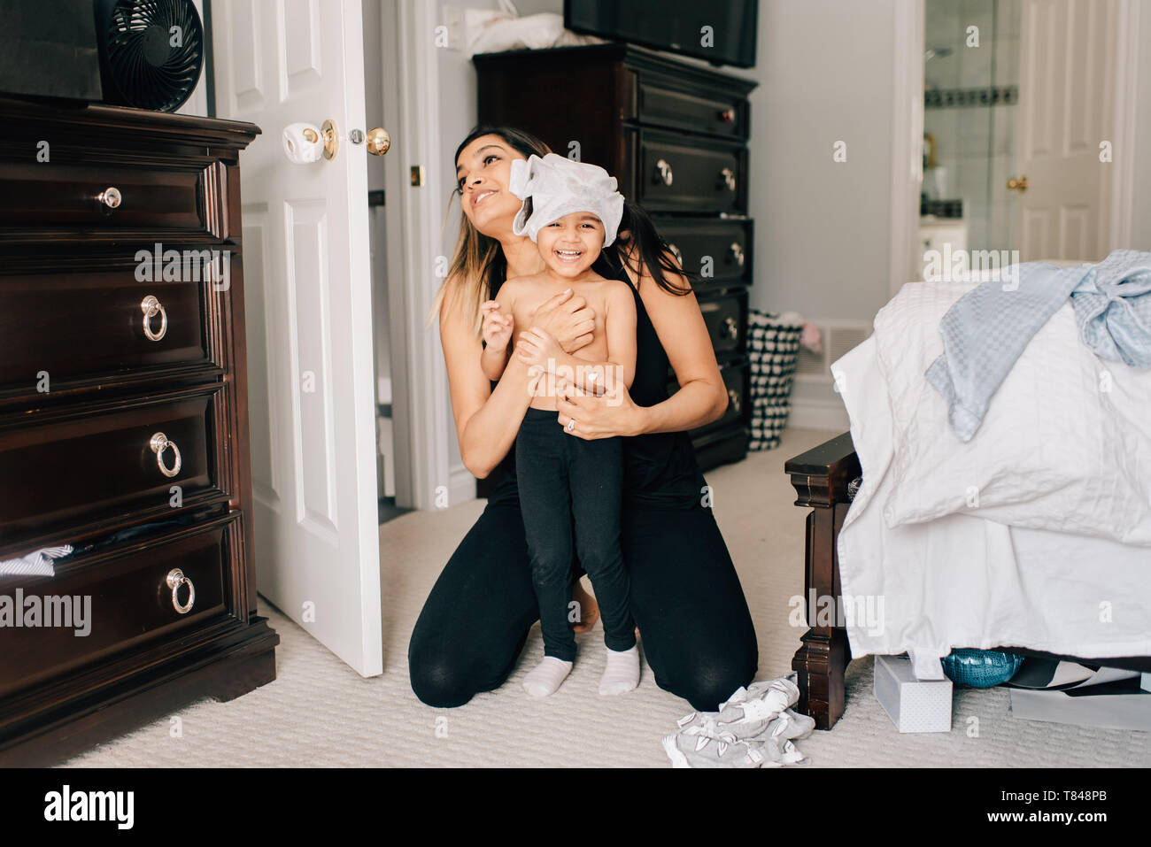 Girl and mother getting ready in bedroom, portrait Stock Photo - Alamy