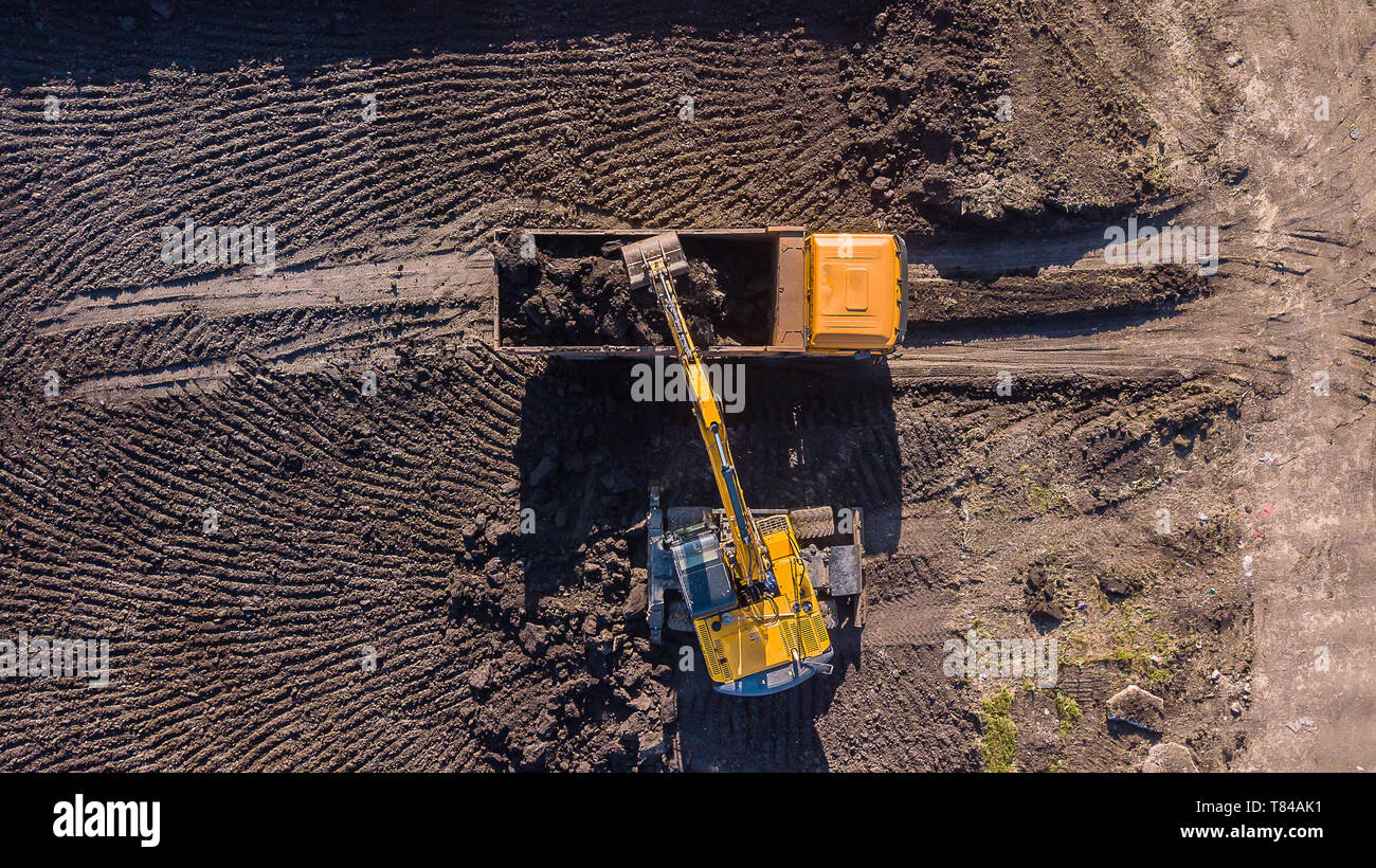 Top down view of an excavator and truck working Stock Photo - Alamy