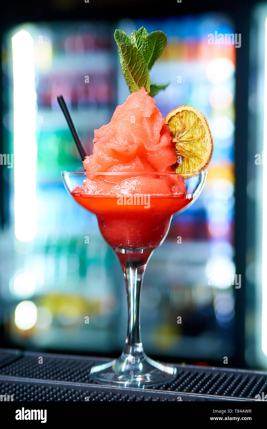 Fruit sorbet in a glass on a blurred background Stock Photo - Alamy