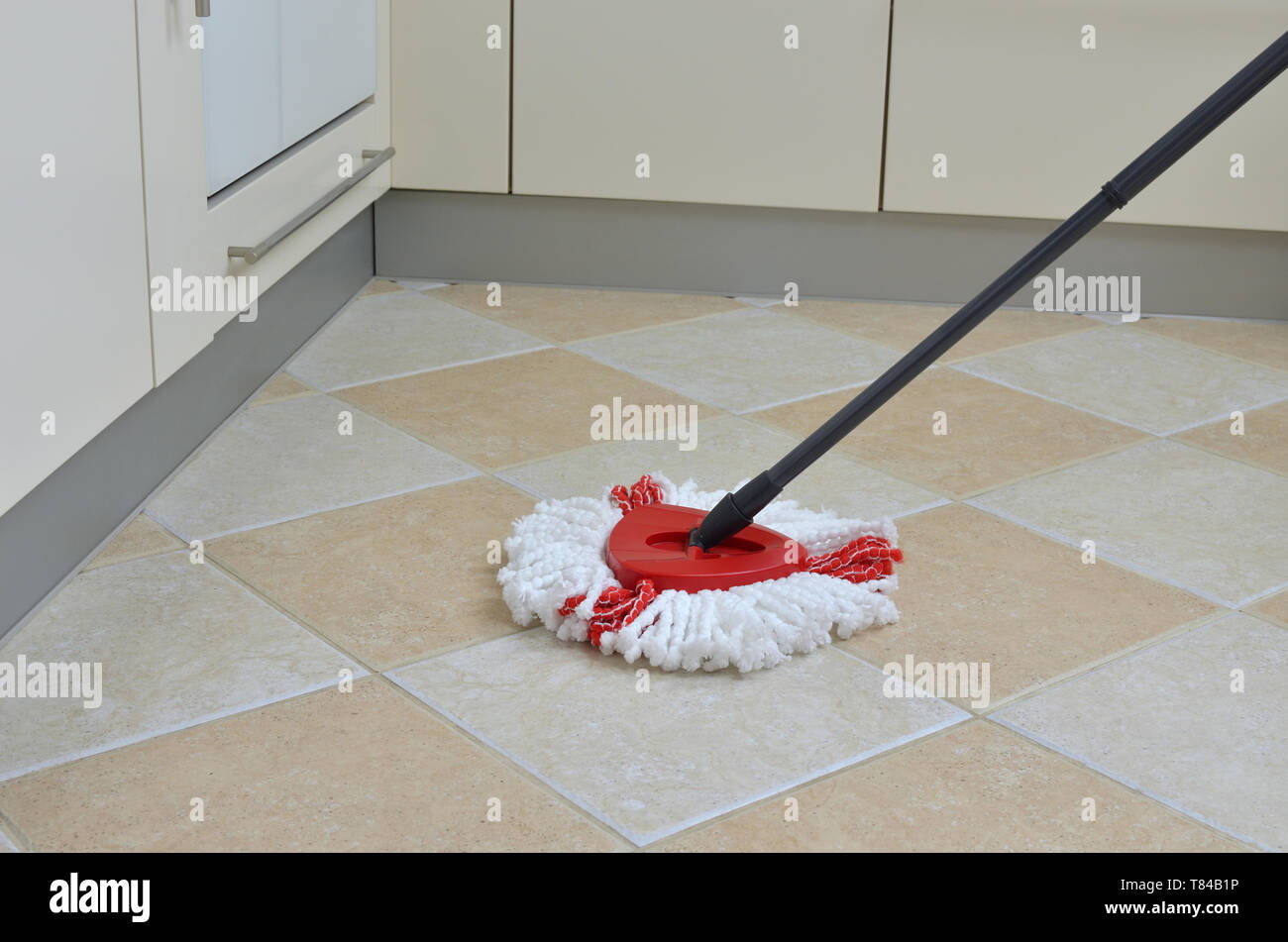 Mopping kitchen floor hi-res stock photography and images - Alamy