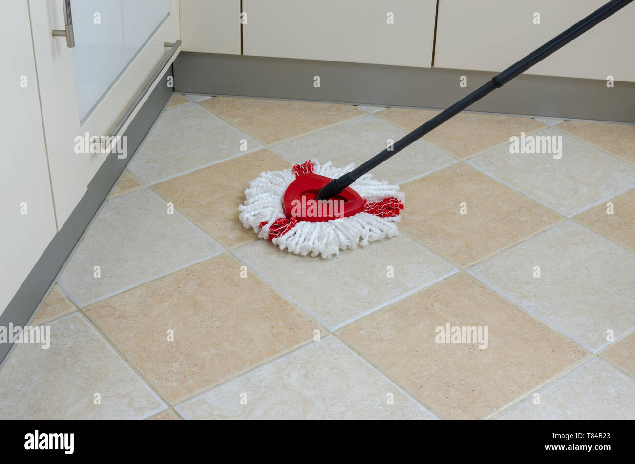 Mop on a kitchen floor during a housework Stock Photo - Alamy
