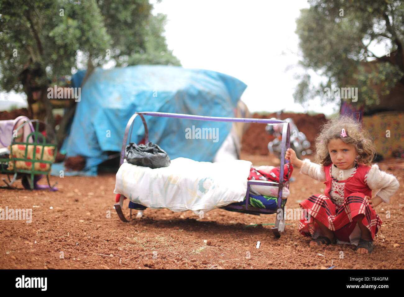 Atme, Syria. 10th May, 2019. A Syrian child plays in a camp for ...