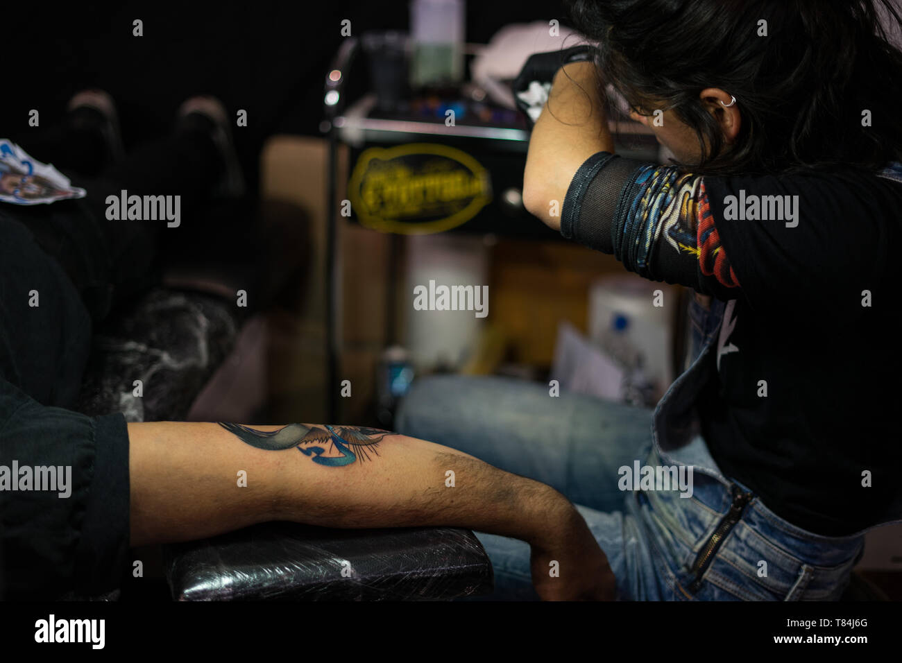 Athens, Attica, Greece. 10th June, 2019. A tattoo artist seen making a ...