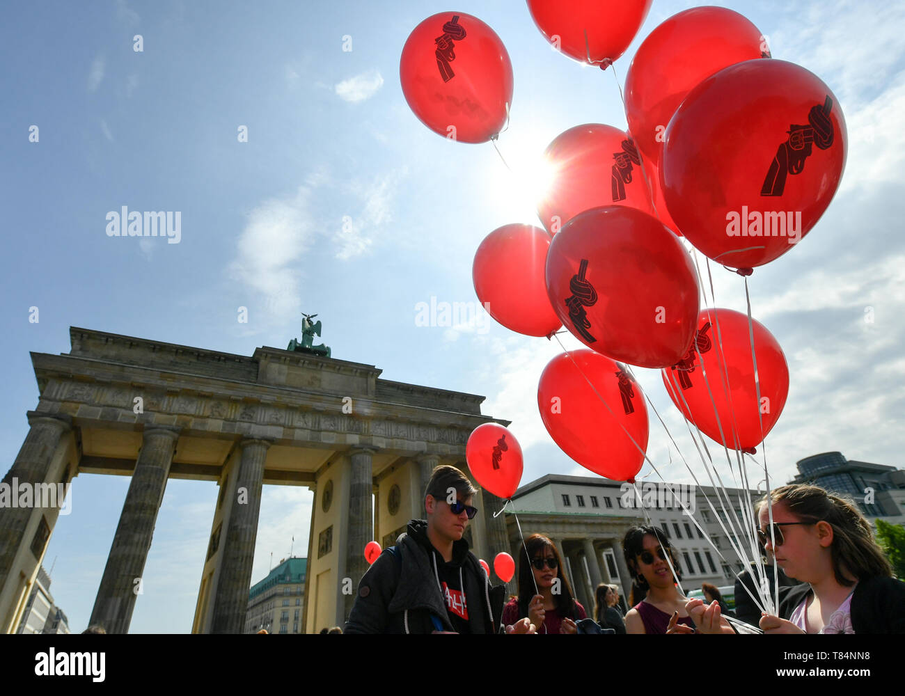 Berlin, Germany. 11th May, 2019. Balloons depicting a pistol with a ...