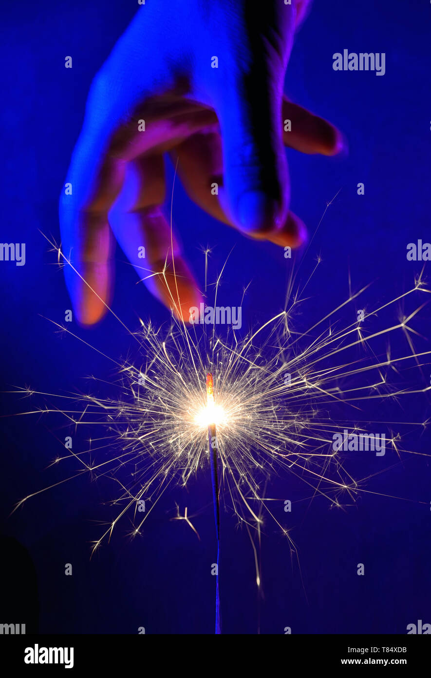 Hand and Fire Light Sparkler in night Stock Photo - Alamy