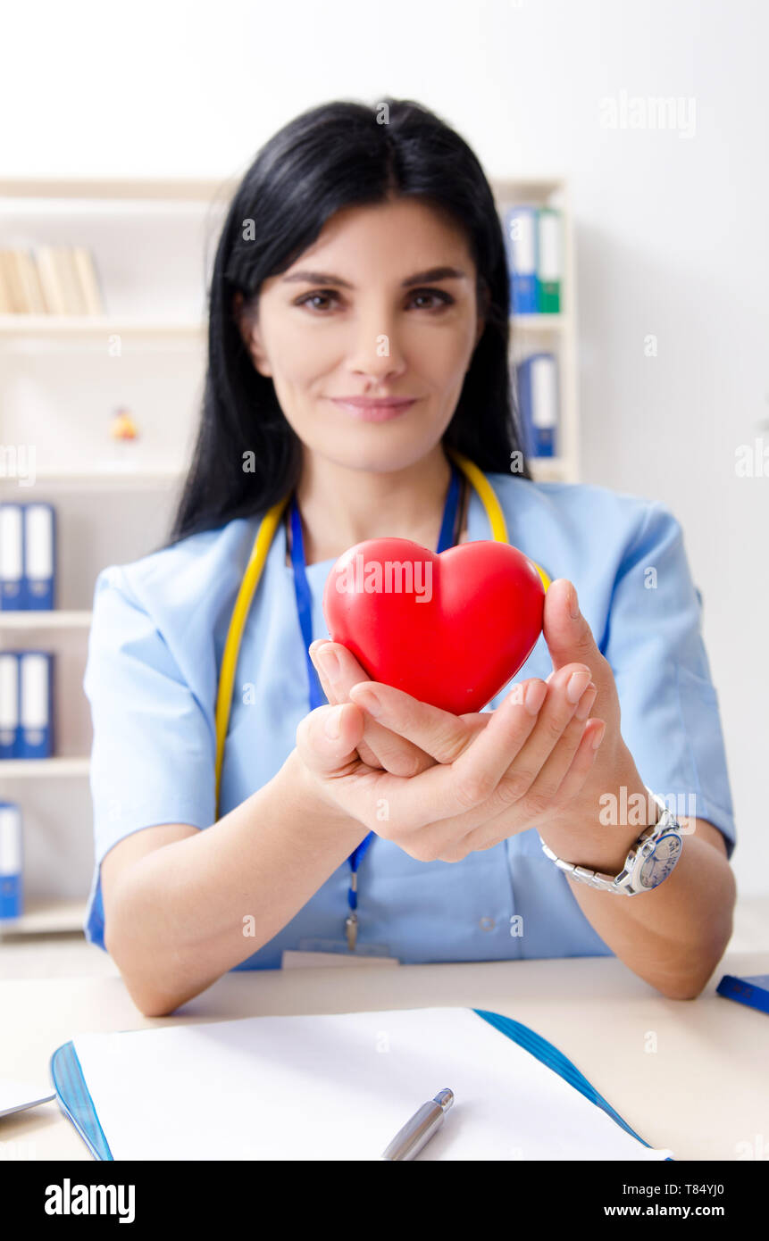 Female doctor cardiologist working in the clinic Stock Photo - Alamy