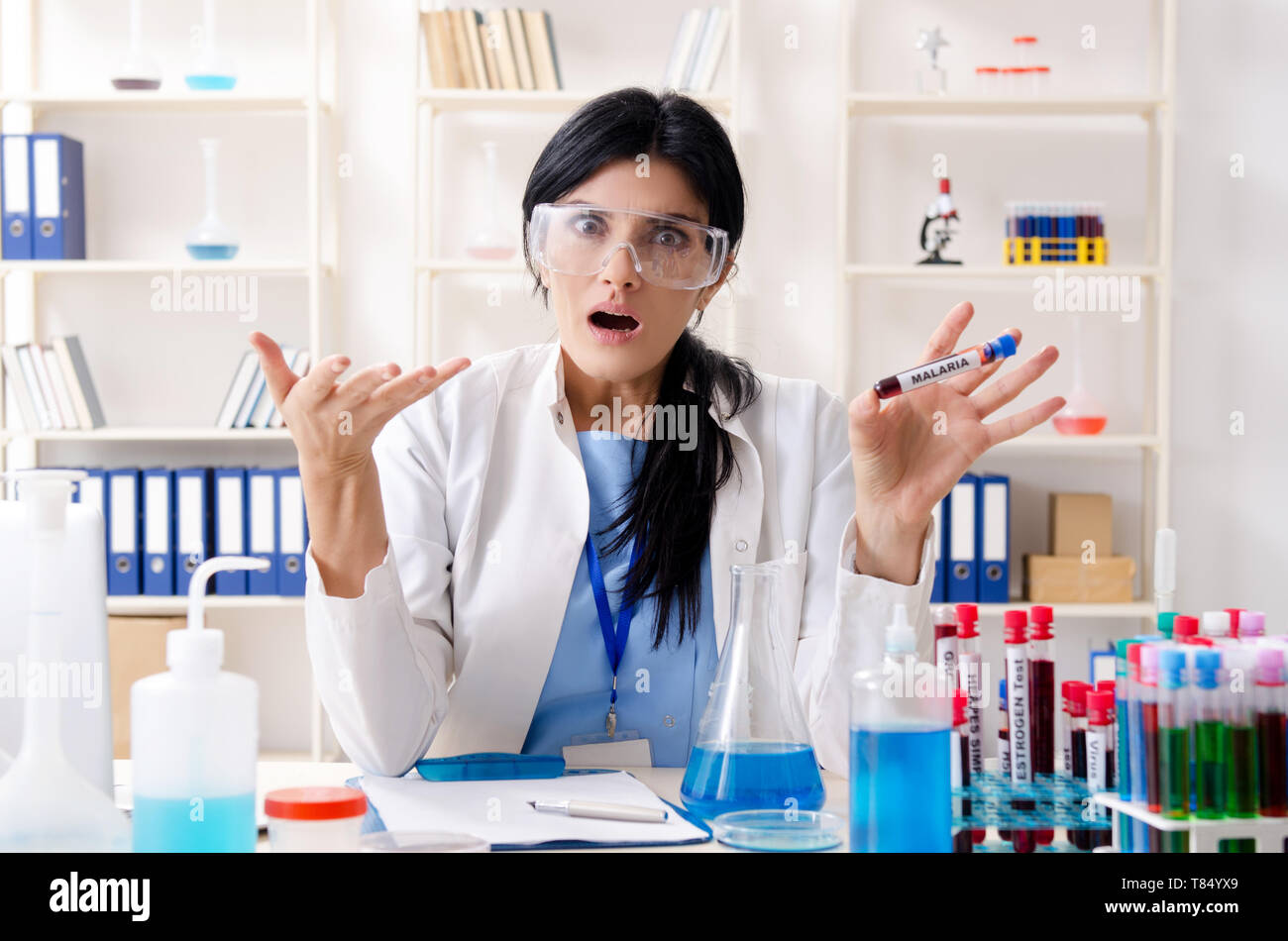 Female chemist working at the lab Stock Photo - Alamy