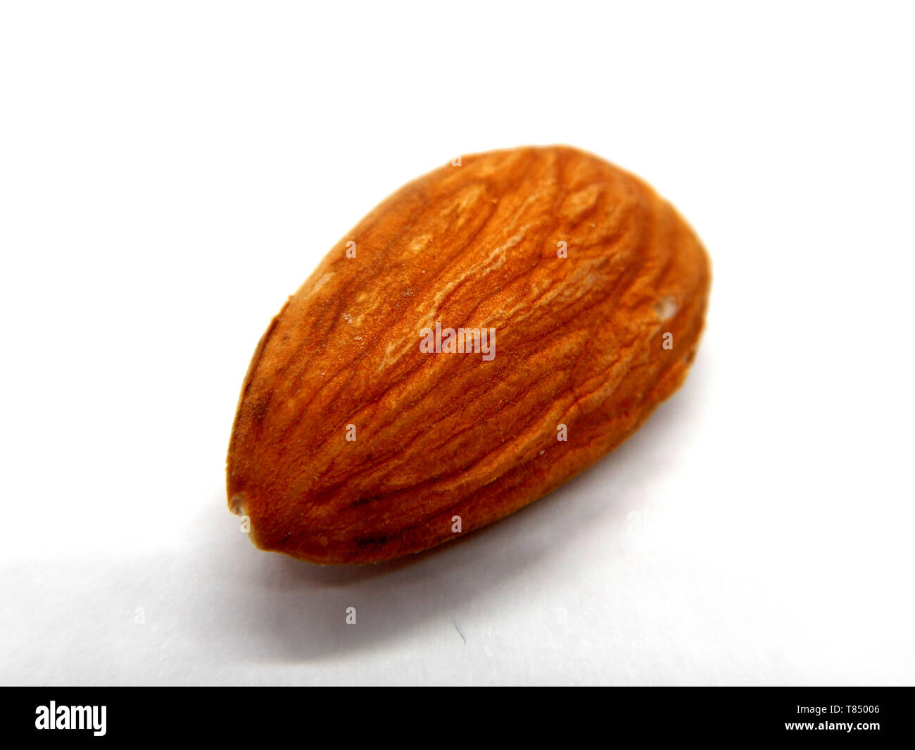 almond close up isolated on white background Stock Photo - Alamy